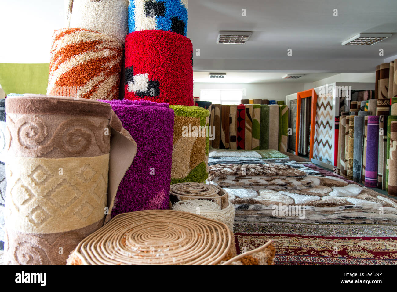 Colorful Collection Of Carpets And Rugs Folded And Displayed. Textured ...