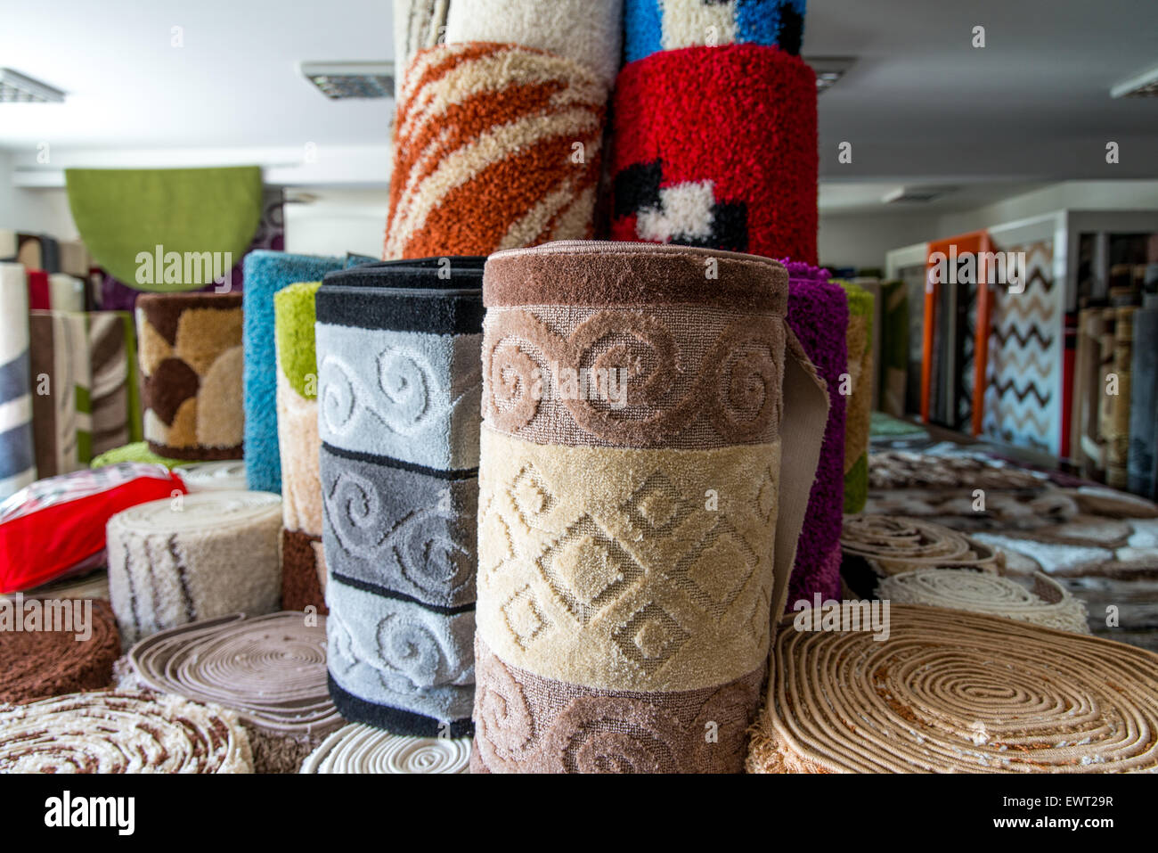 Colorful Collection Of Carpets And Rugs Folded And Displayed. Textured ...