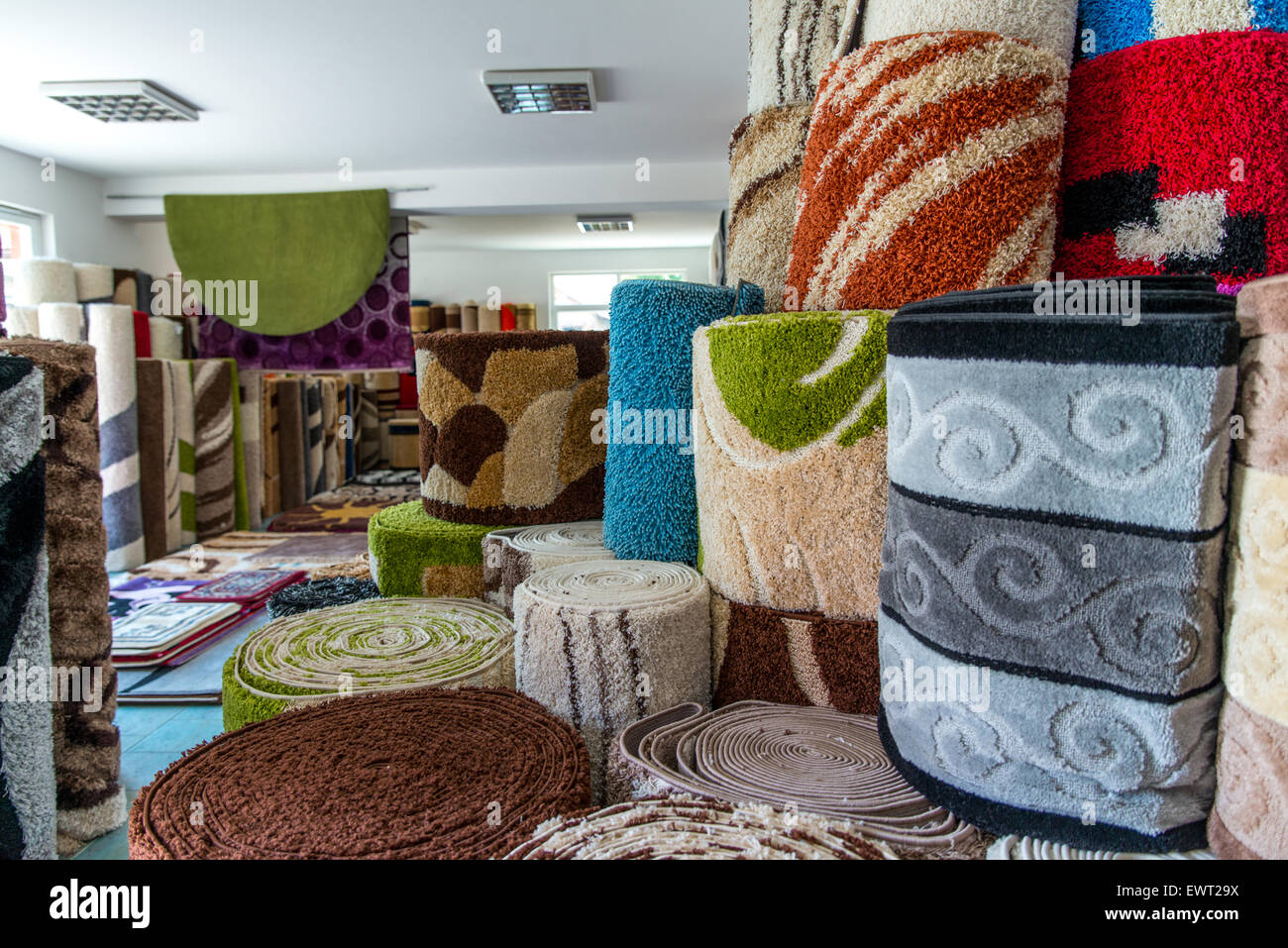 Colorful Collection Of Carpets And Rugs Folded And Displayed. Textured ...