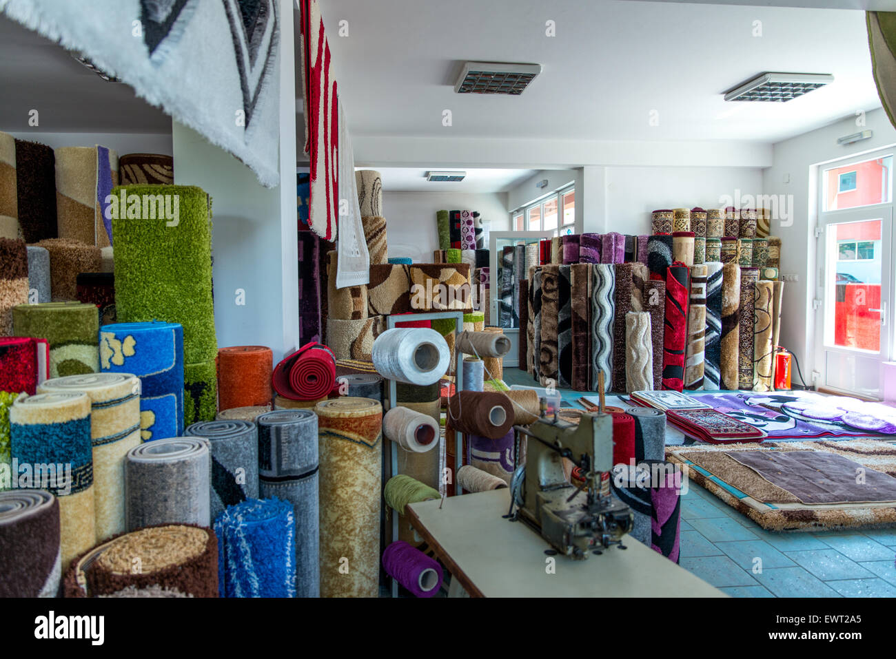 Colorful Collection Of Carpets And Rugs Folded And Displayed. Textured ...