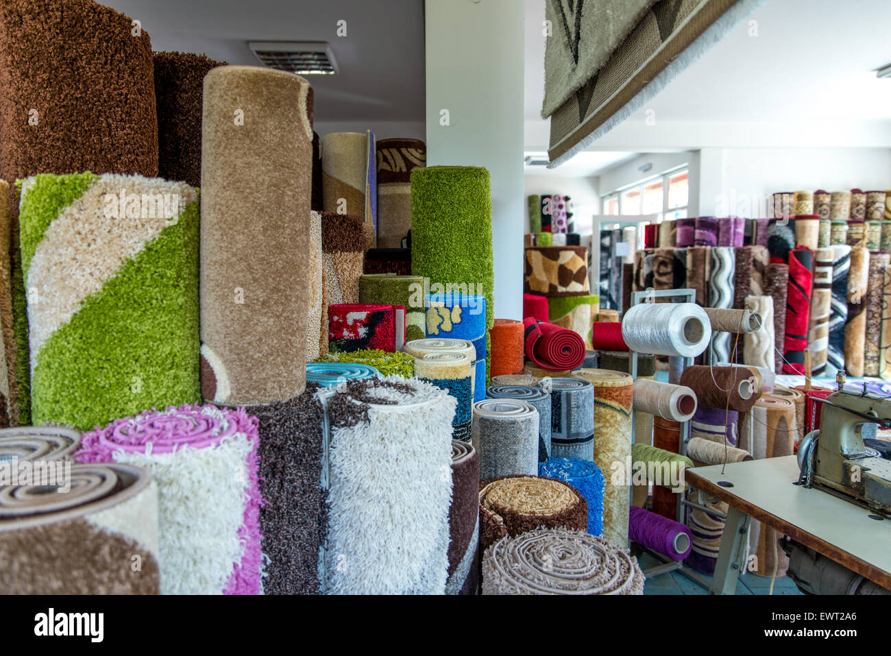Colorful Collection Of Carpets And Rugs Folded And Displayed. Textured ...