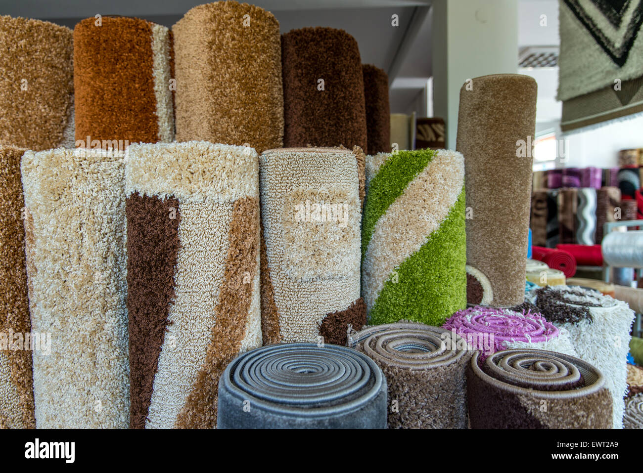 Colorful Collection Of Carpets And Rugs Folded And Displayed. Textured ...