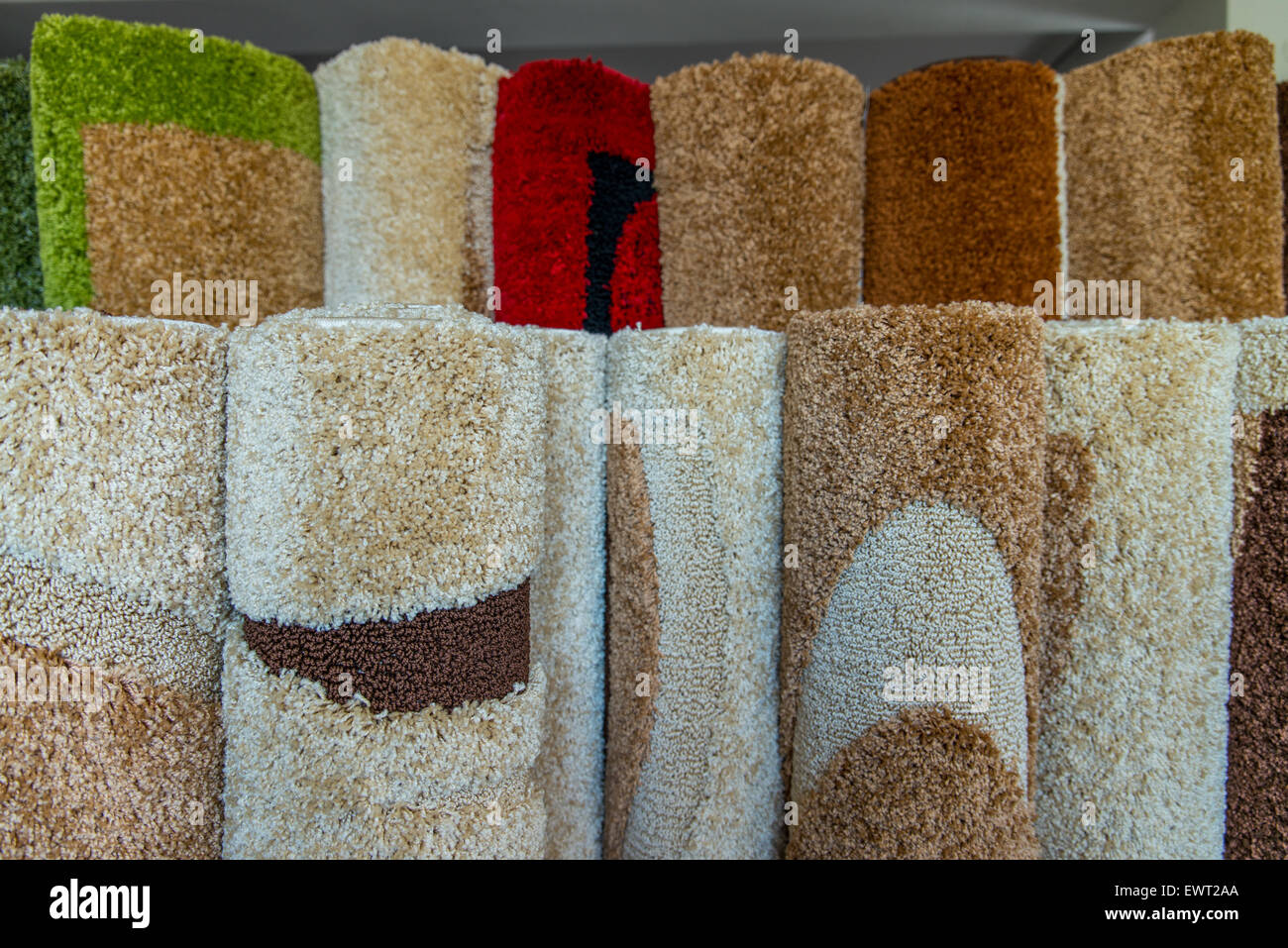Colorful Collection Of Carpets And Rugs Folded And Displayed. Textured ...