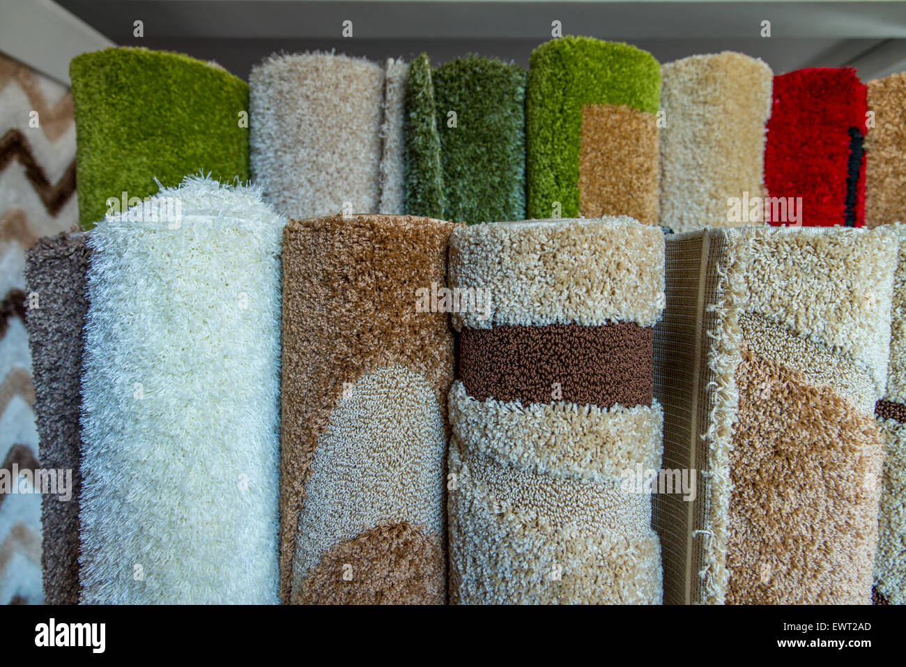 Colorful Collection Of Carpets And Rugs Folded And Displayed. Textured ...