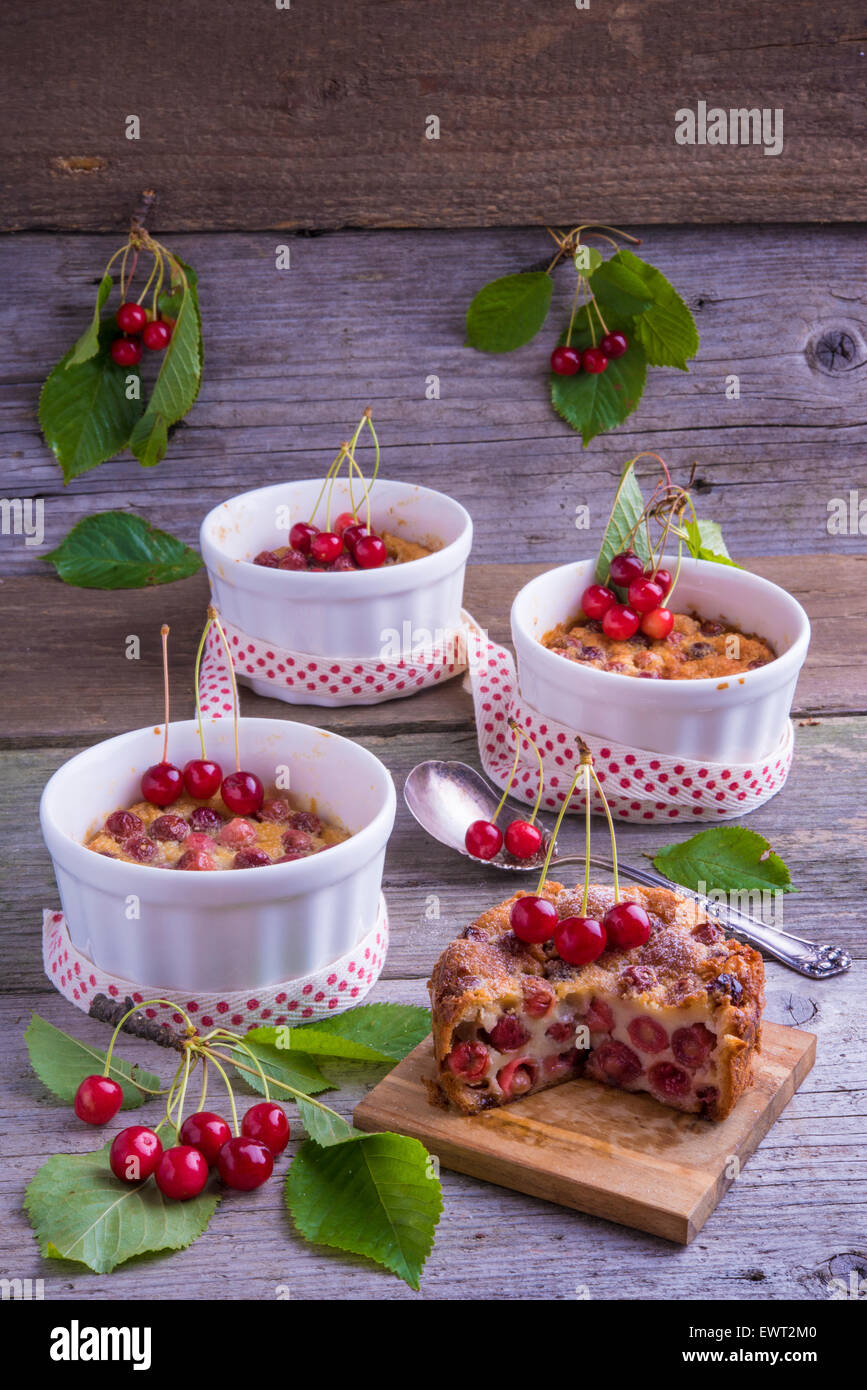 Cherry Clafoutis, traditional French dessert. Baked batter pudding with ...