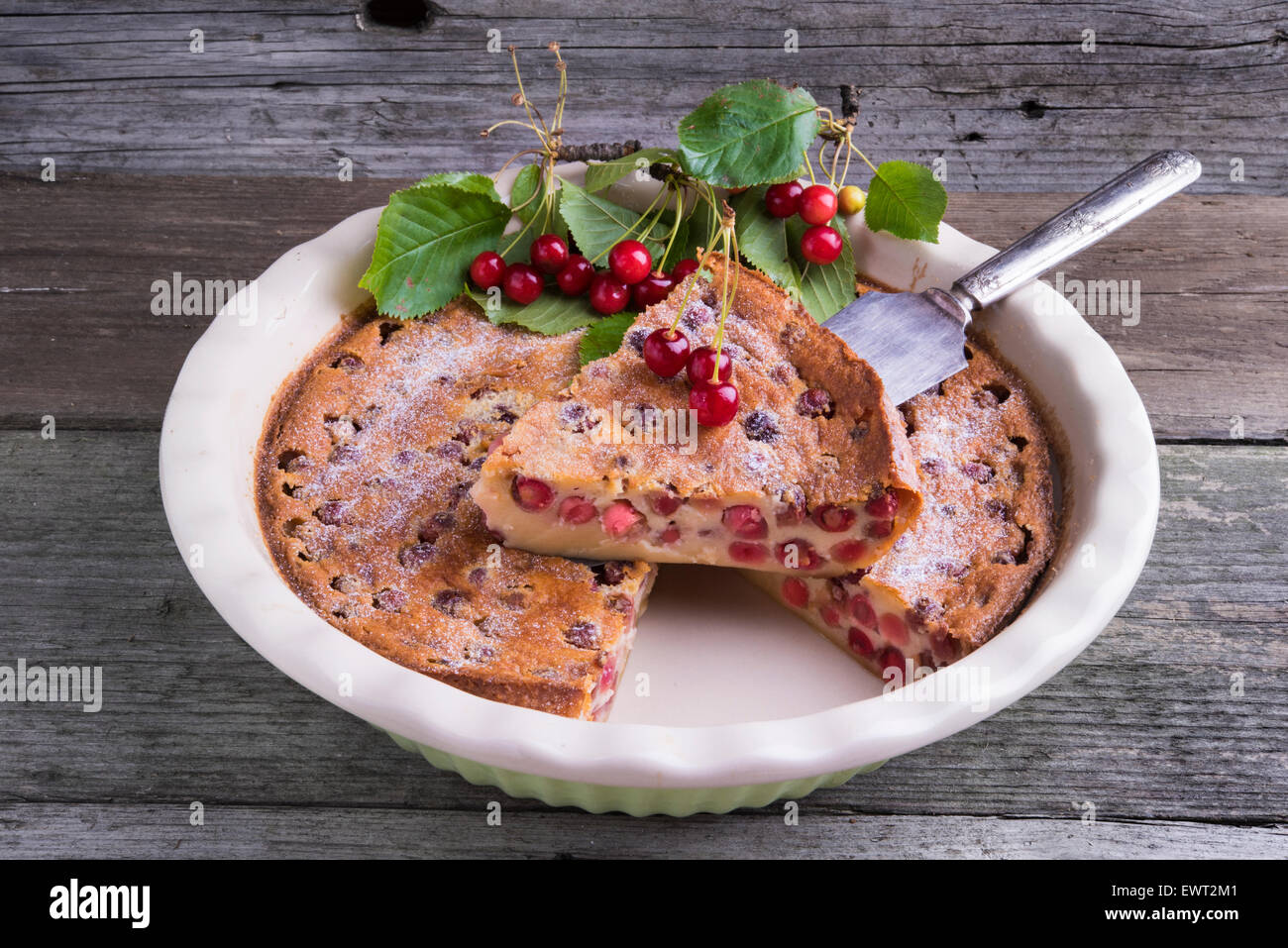 Cherry Clafoutis, traditional French dessert. Baked batter pudding with ...