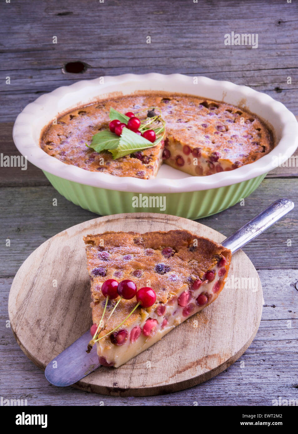 Cherry Clafoutis, traditional French dessert. Baked batter pudding with ...