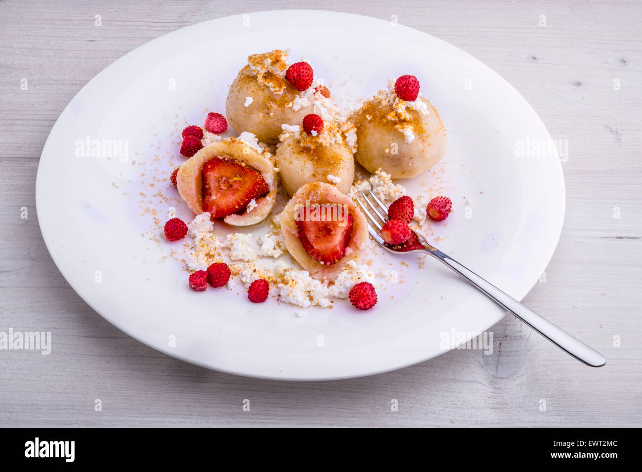 Strawberries wrapped in quark based dough, served with crumbled quark ...