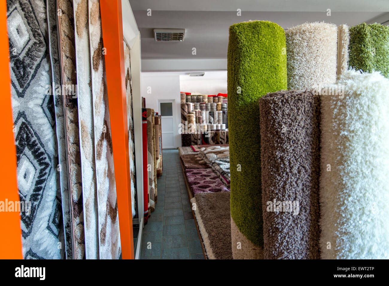 Colorful Collection Of Carpets And Rugs Folded And Displayed. Textured ...