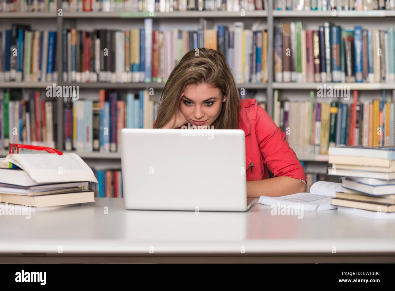In The Library - Pretty Female Student With Laptop And Books Working In ...