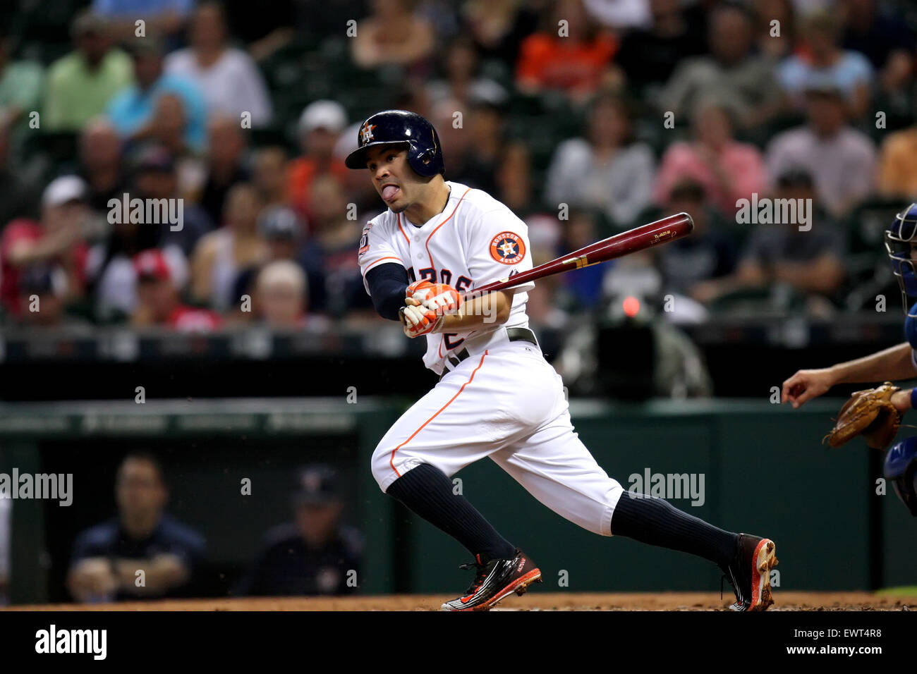 Houston, TX, USA. 30th June, 2015. Houston Astros second baseman Jose Altuve #27 hits a ground ...