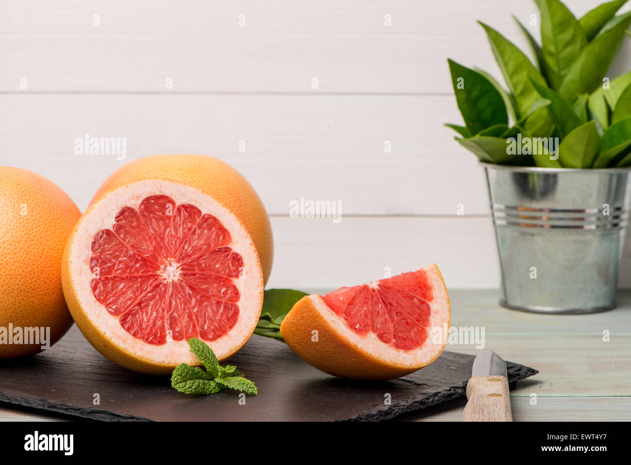 Ripe grapefruit close-up on wooden table background Stock Photo - Alamy
