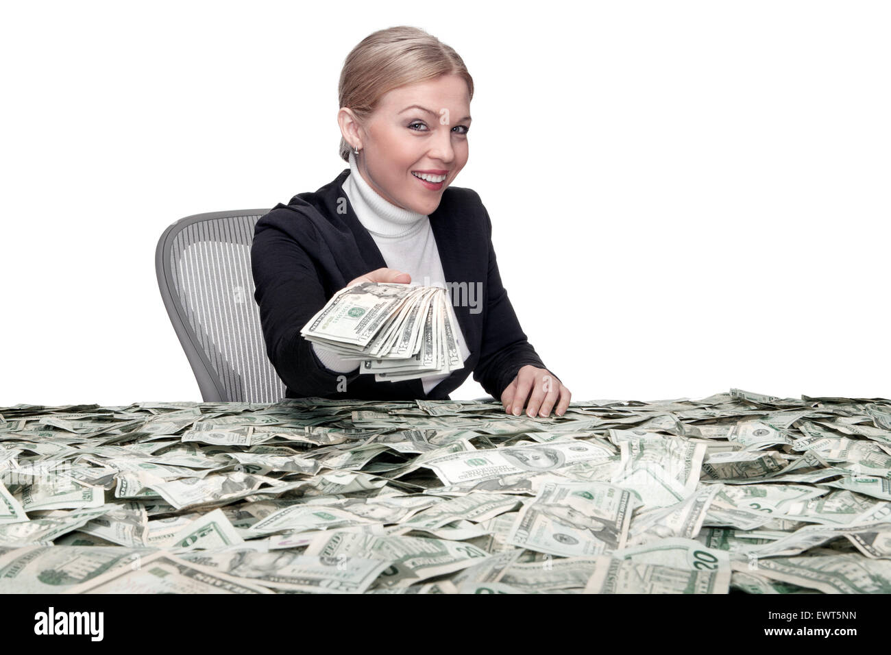 portrait of young woman sitting behind the table full of cash Stock ...