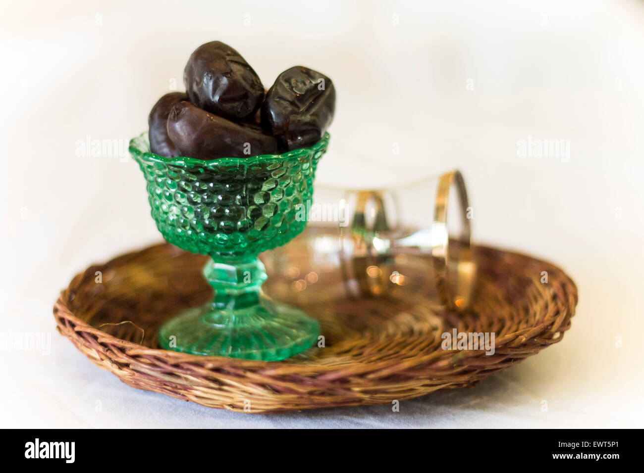 iftar black dates in mat texture plate Stock Photo - Alamy