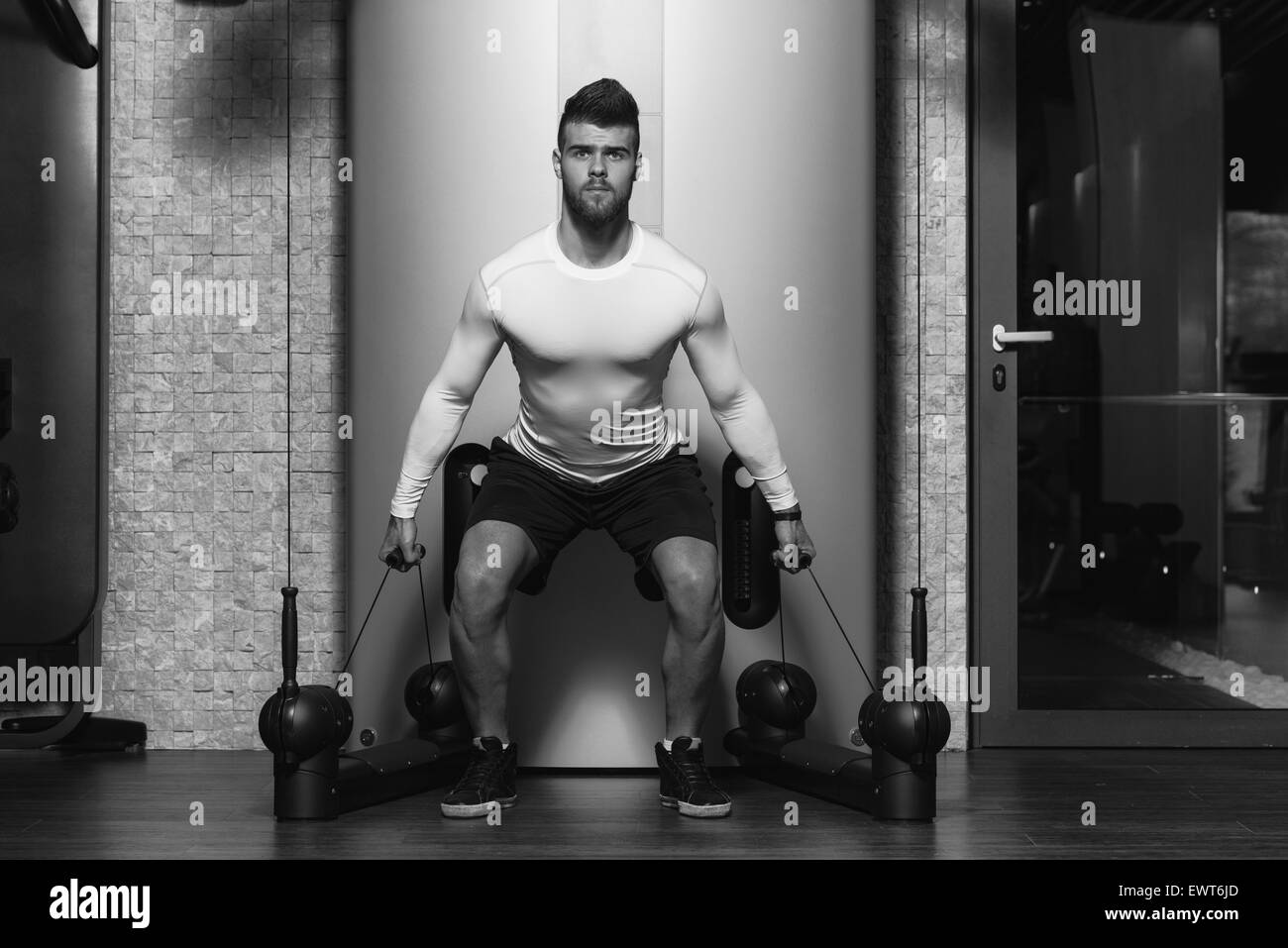 Young Man Doing Heavy Weight Exercise For Back In Gym Stock Photo - Alamy