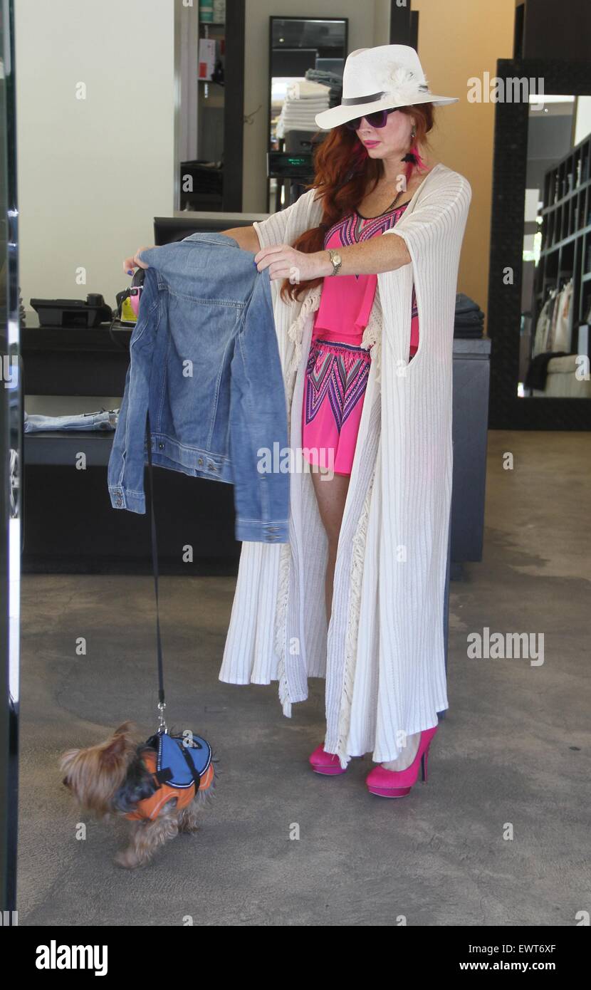 Phoebe Price out and about in Beverly Hills wearing a full length white ...