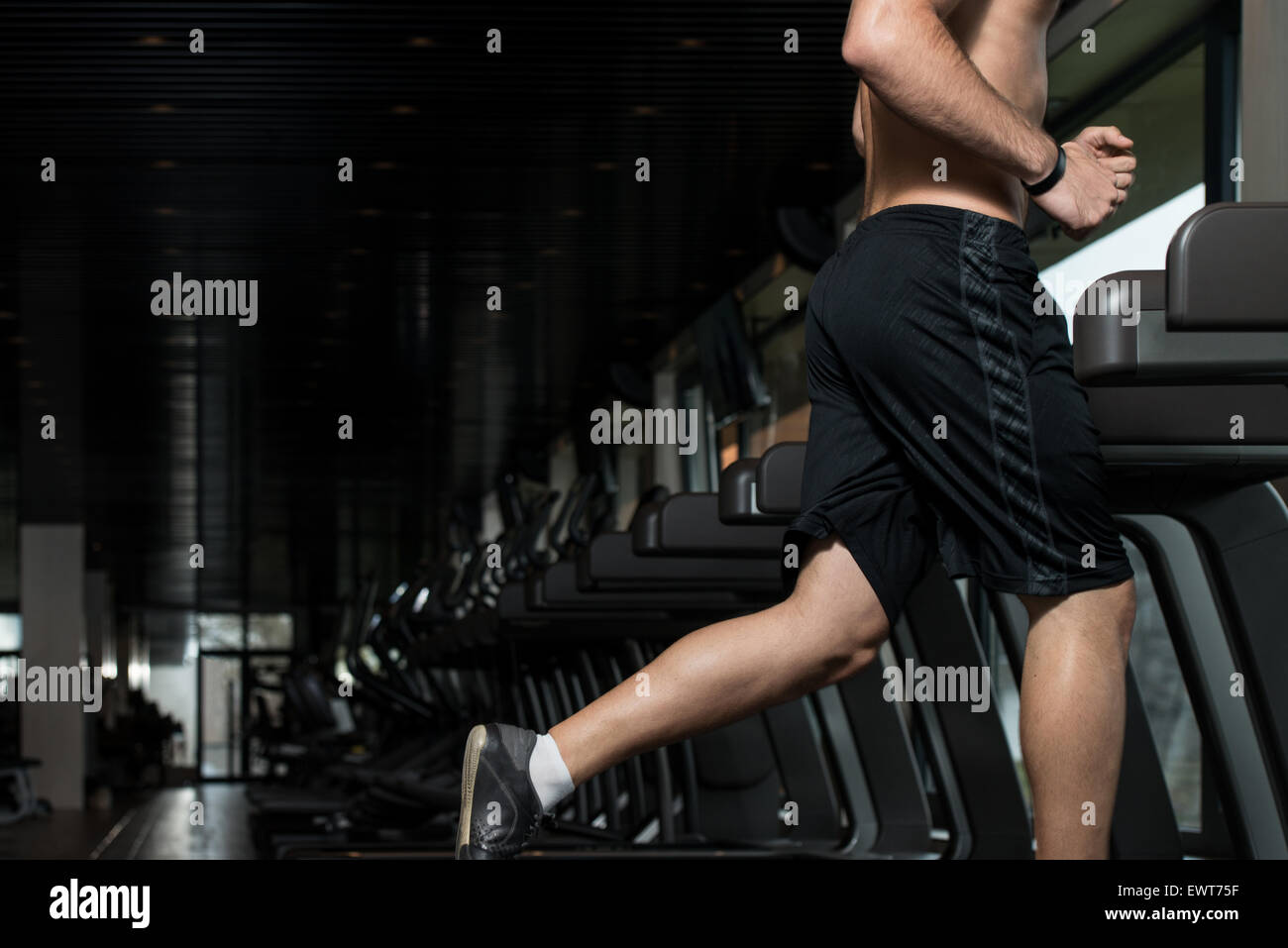 Close Up Of Male Legs Running On Treadmill - Blurred Motion Stock Photo ...
