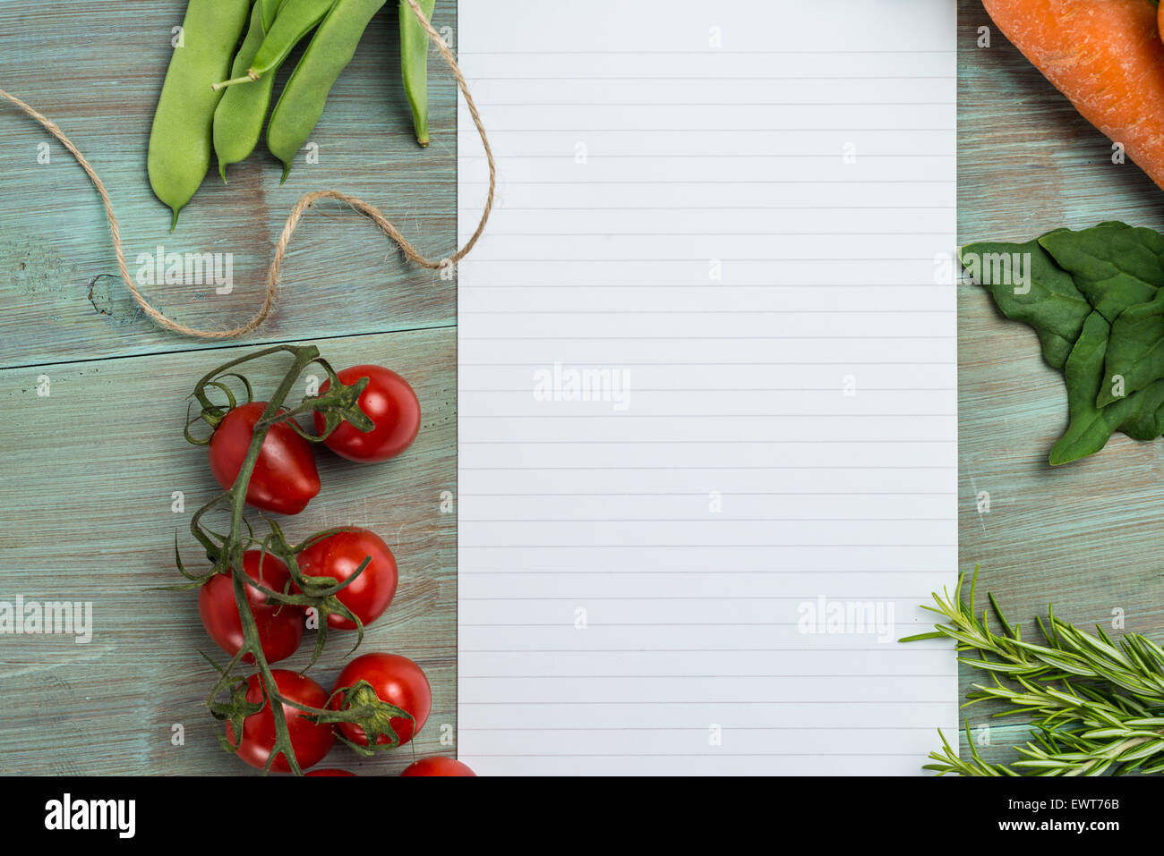 Blank white paper and fresh colorful vegetables on kitchen table Stock ...
