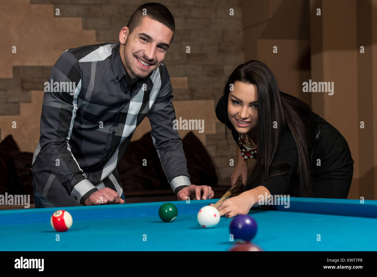 Young Caucasian Woman Receiving Advice On Shooting Pool Ball While ...