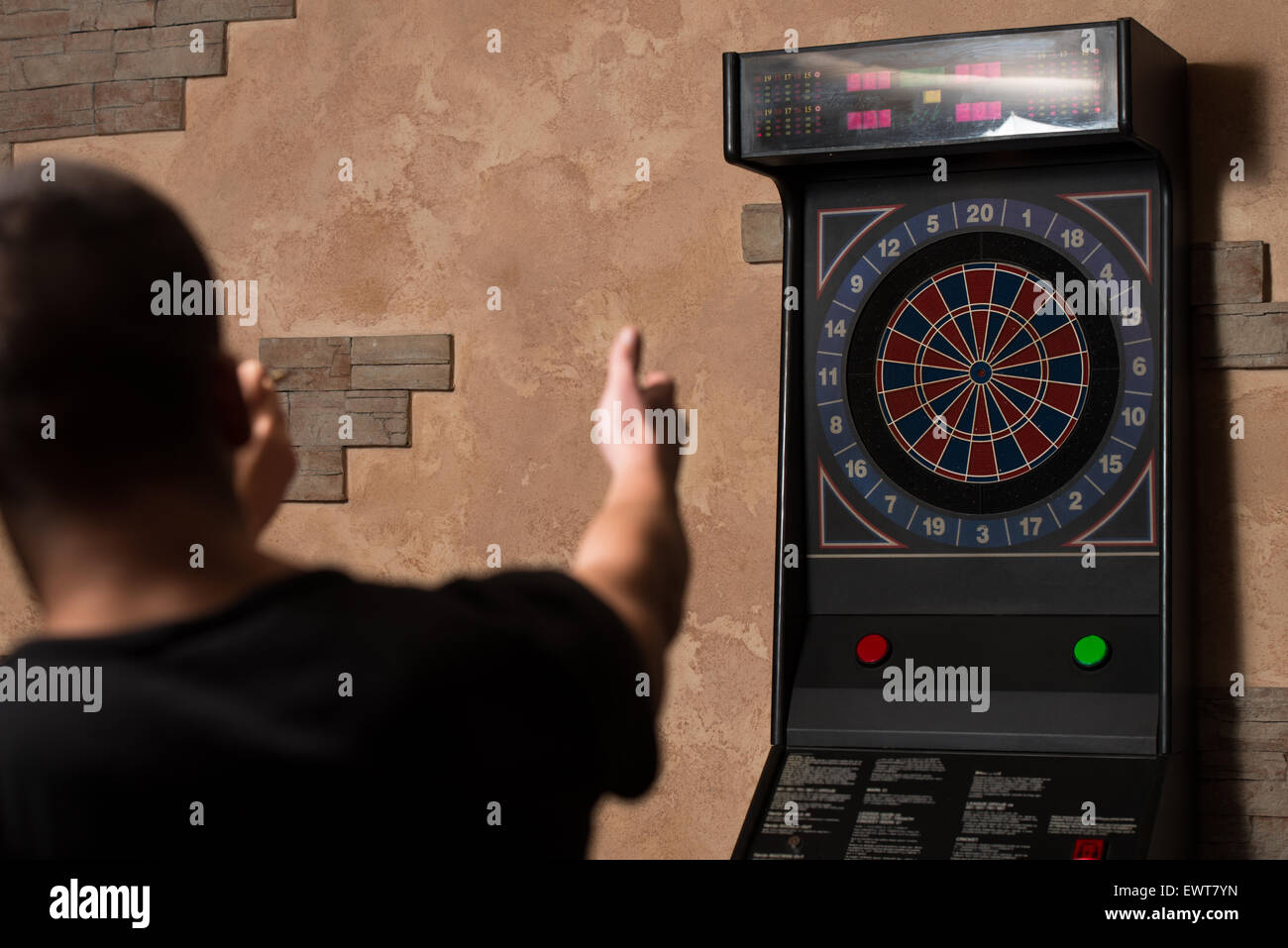 Young Couple Playing A Game Shooting Darts Stock Photo - Alamy