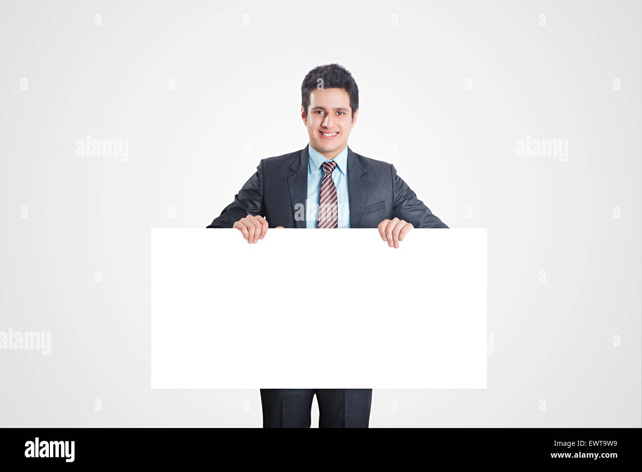 1 indian Business Man Showing Message Board Stock Photo - Alamy