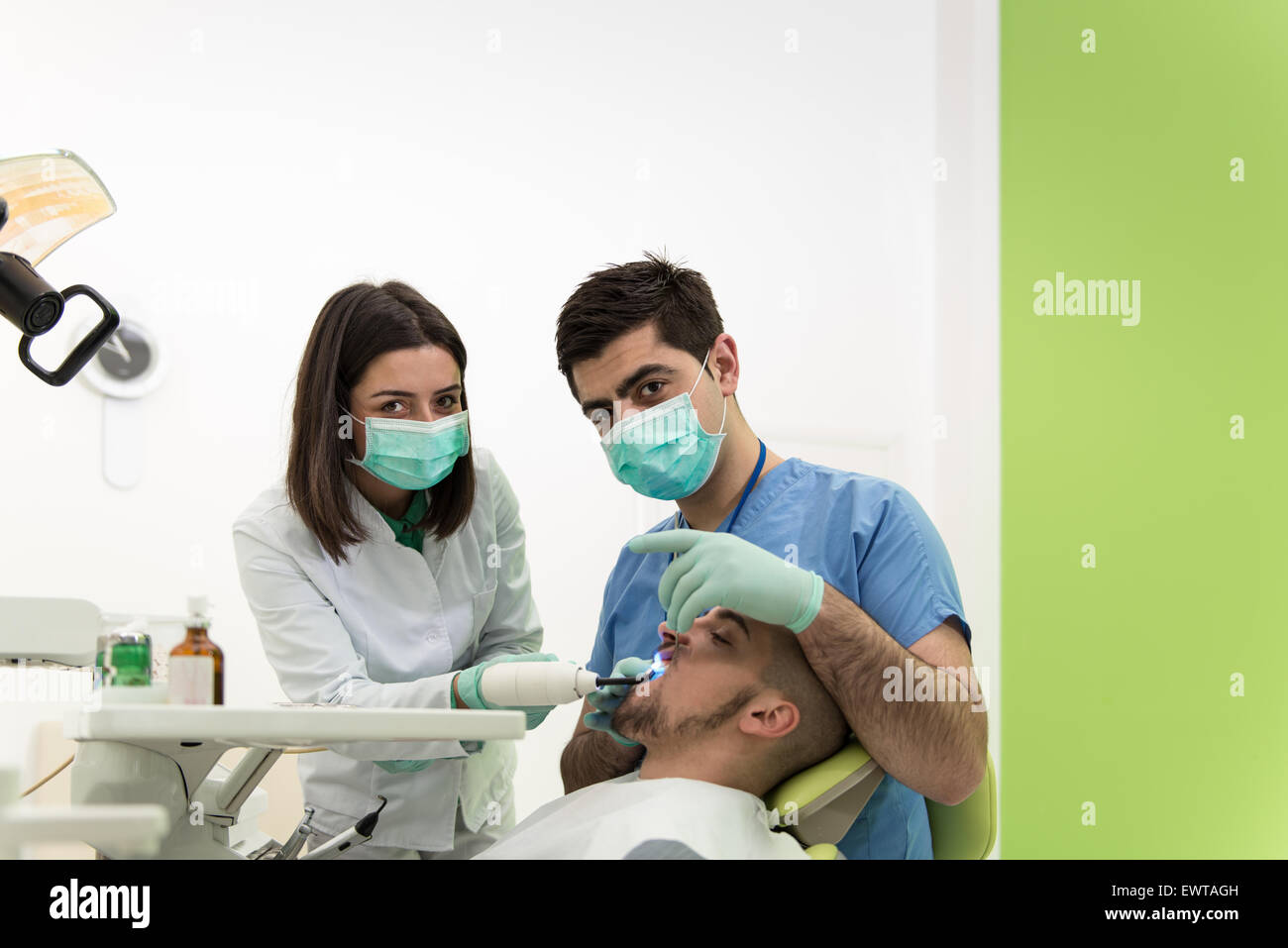 Surgery At The Dentist Office - Doctor Is Working On The Patients Mouth ...