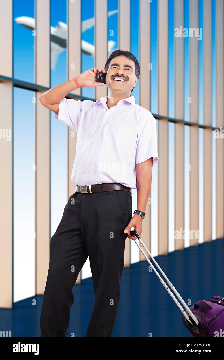 Indian man waiting at airport hi-res stock photography and images - Alamy