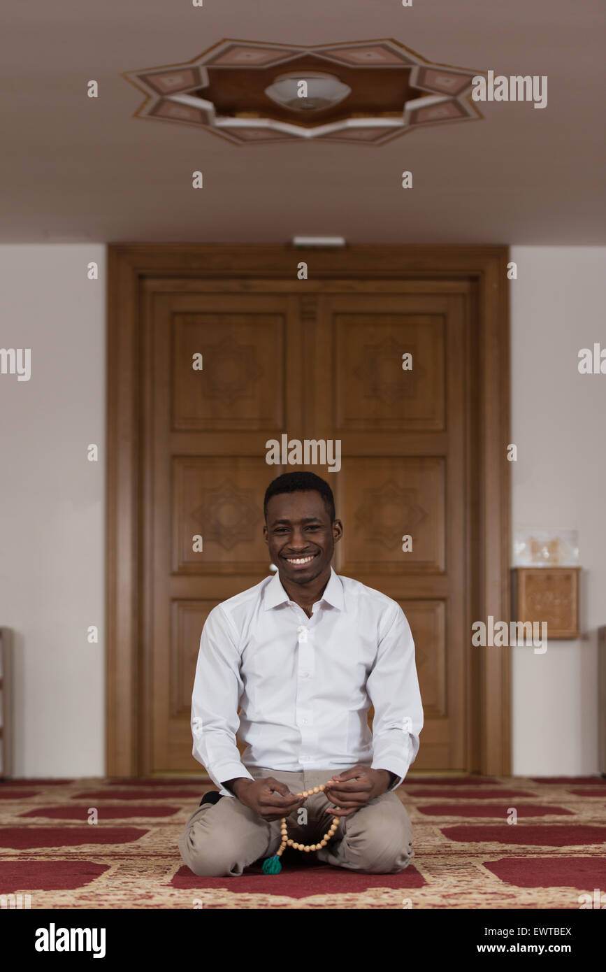 Black African Muslim Man Is Praying In The Mosque Stock Photo - Alamy
