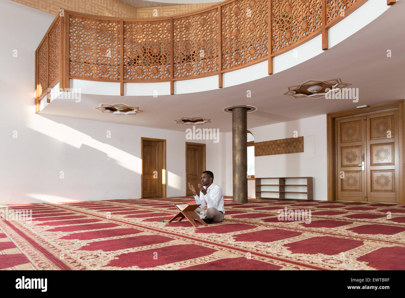 Black African Muslim Man Is Reading The Koran Stock Photo - Alamy