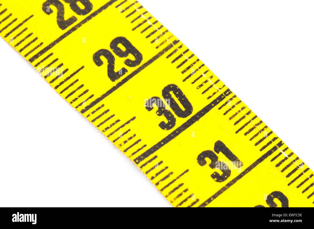 Yellow measuring tape isolated on white background - selective focus ...