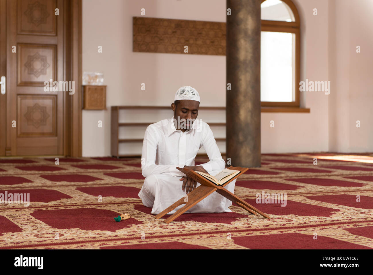 Black African Muslim Man Reading Holy Islamic Book Koran Stock Photo ...