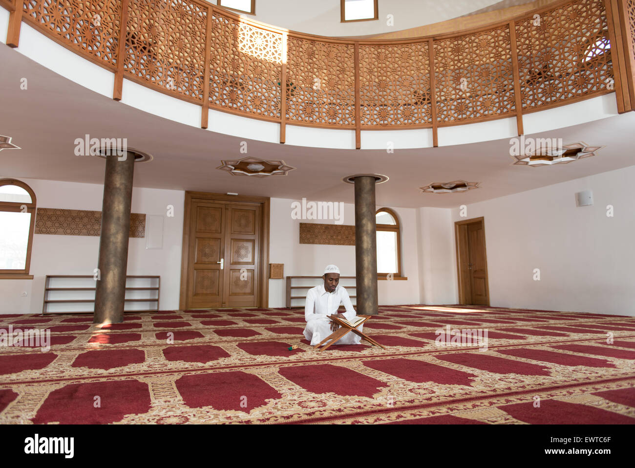 Black African Muslim Man Reading Holy Islamic Book Koran Stock Photo ...