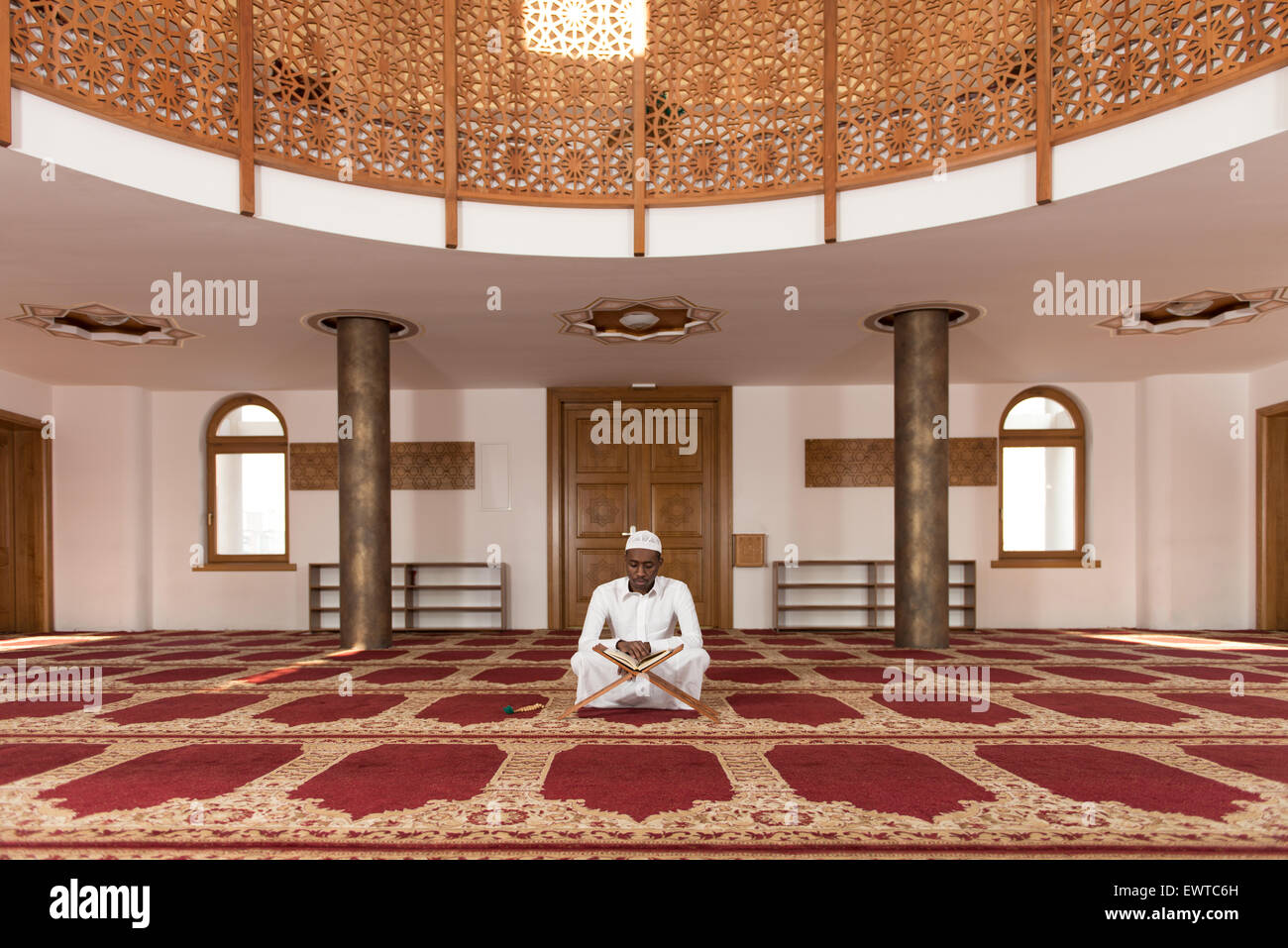 Black African Muslim Man Reading Holy Islamic Book Koran Stock Photo ...