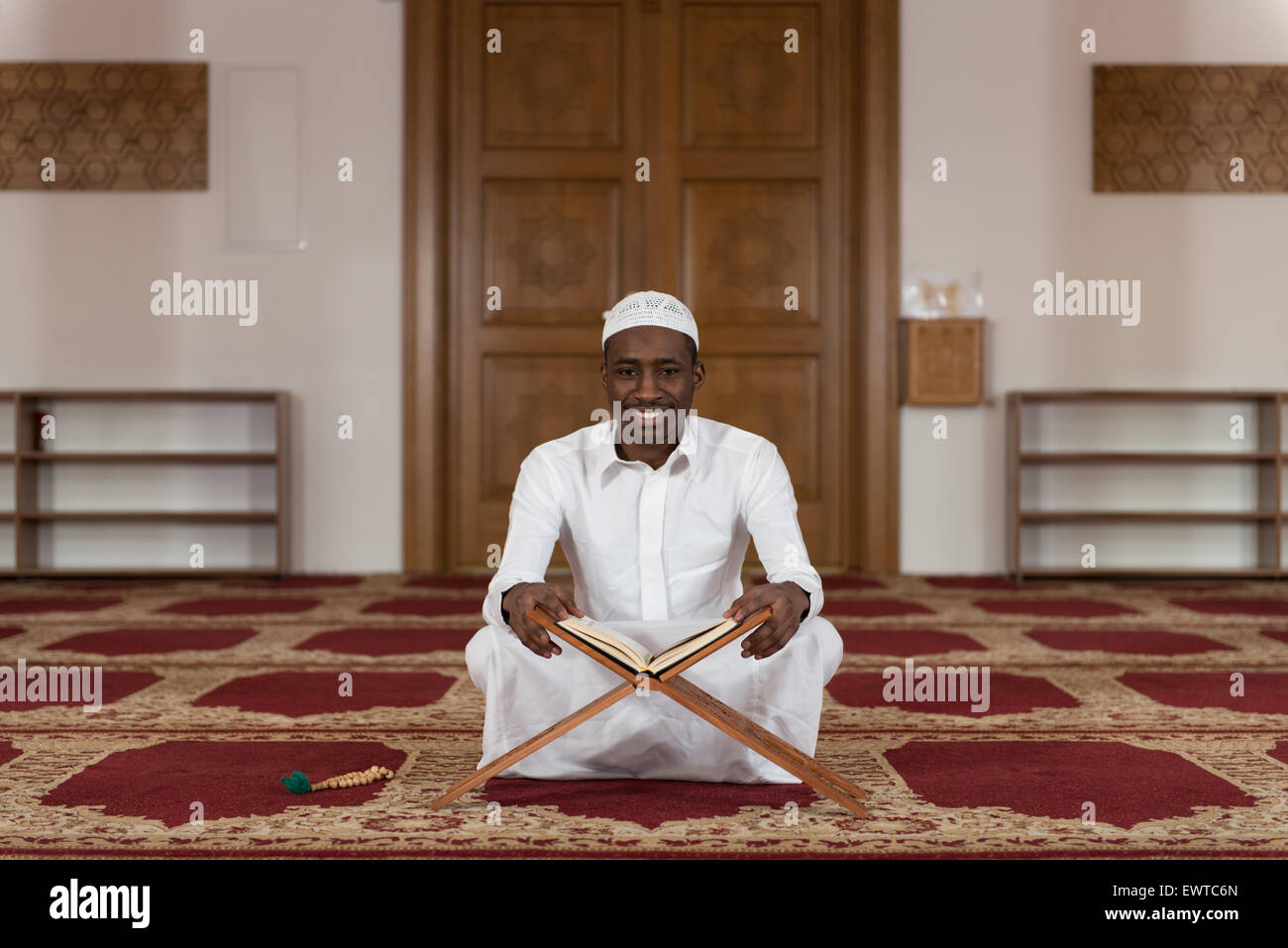 Black African Muslim Man Reading Holy Islamic Book Koran Stock Photo ...
