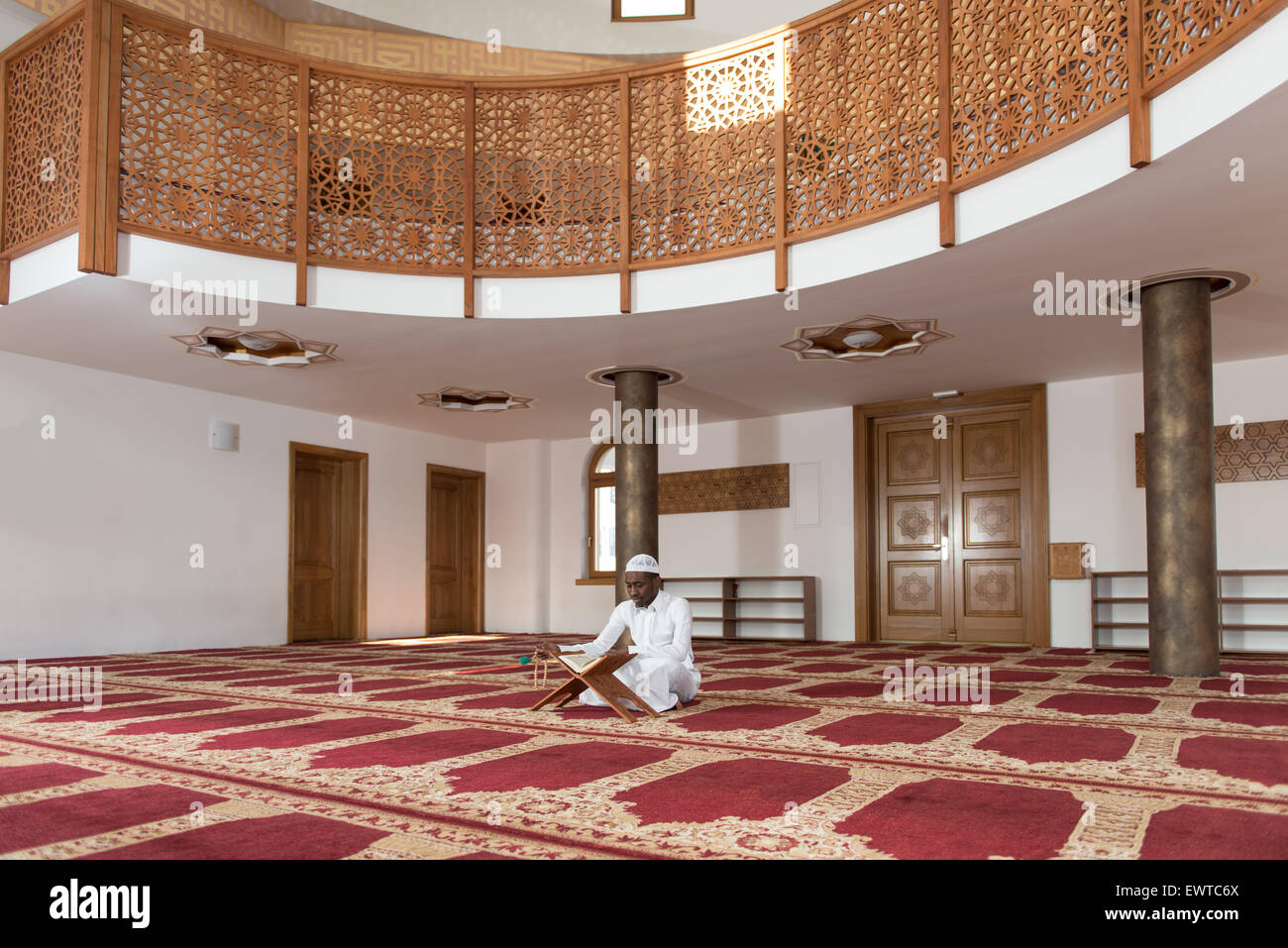 Black African Muslim Man Reading Holy Islamic Book Koran Stock Photo ...
