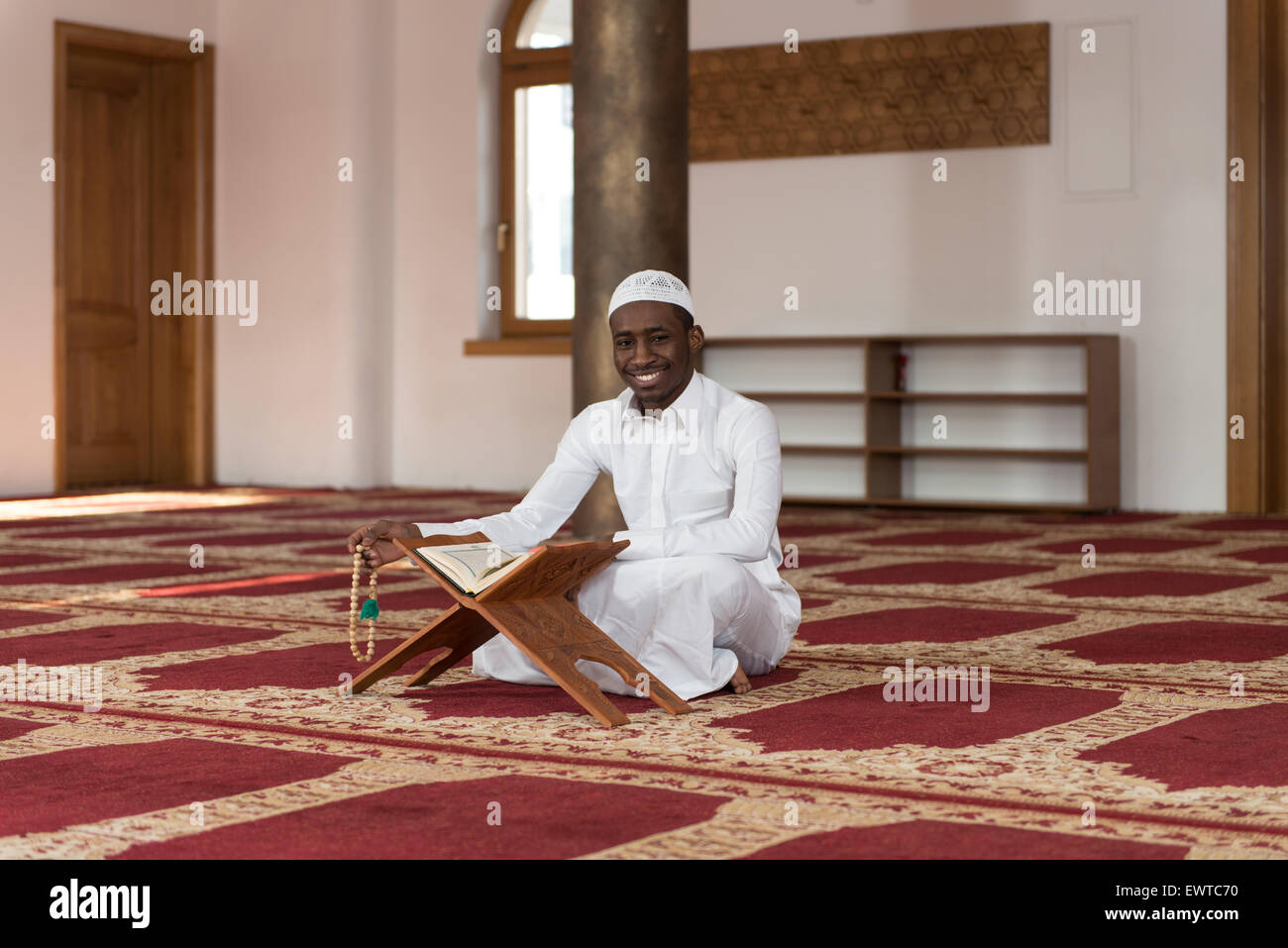 Black African Muslim Man Reading Holy Islamic Book Koran Stock Photo ...