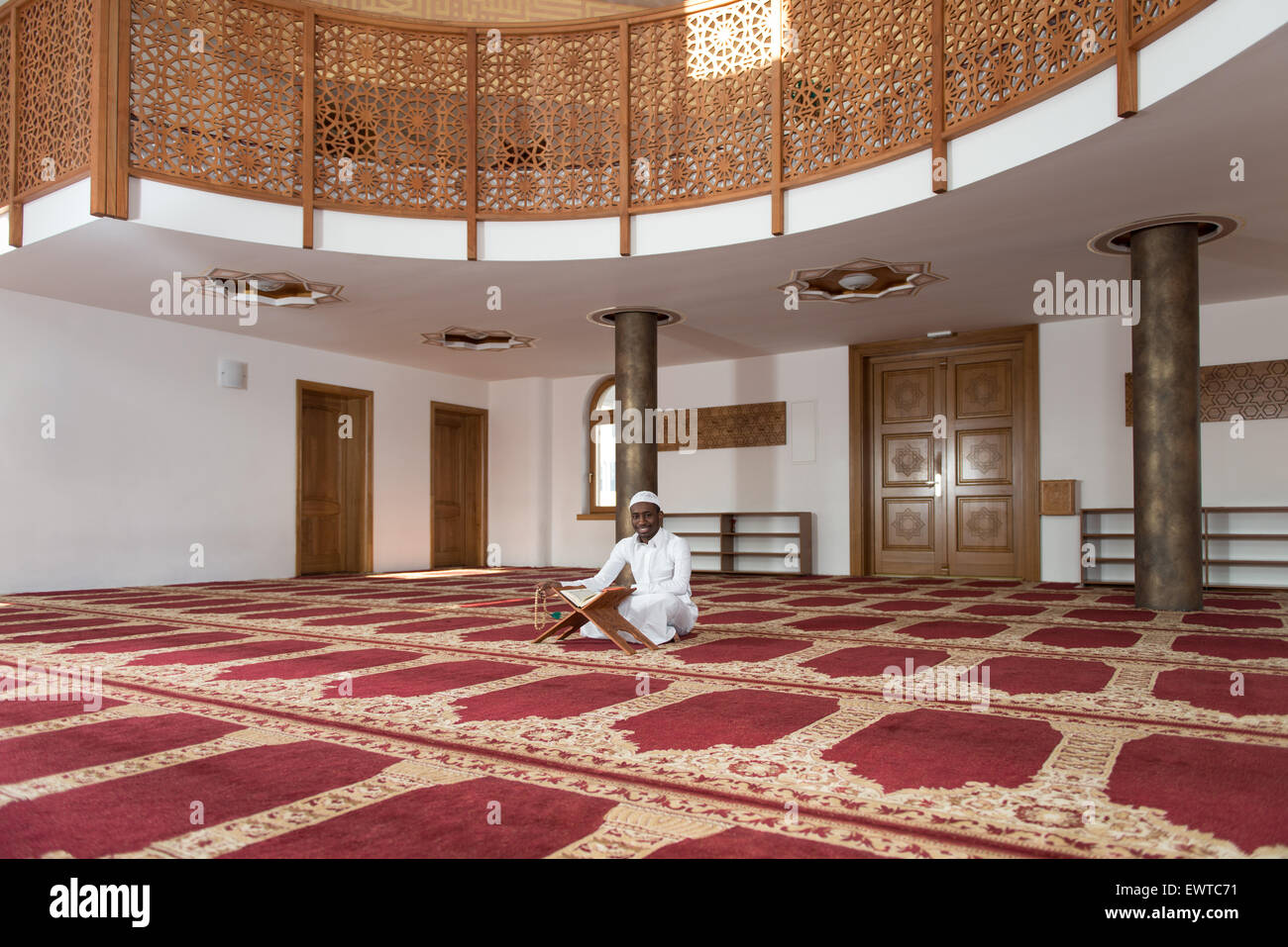 African muslim man reading quran hi-res stock photography and images ...