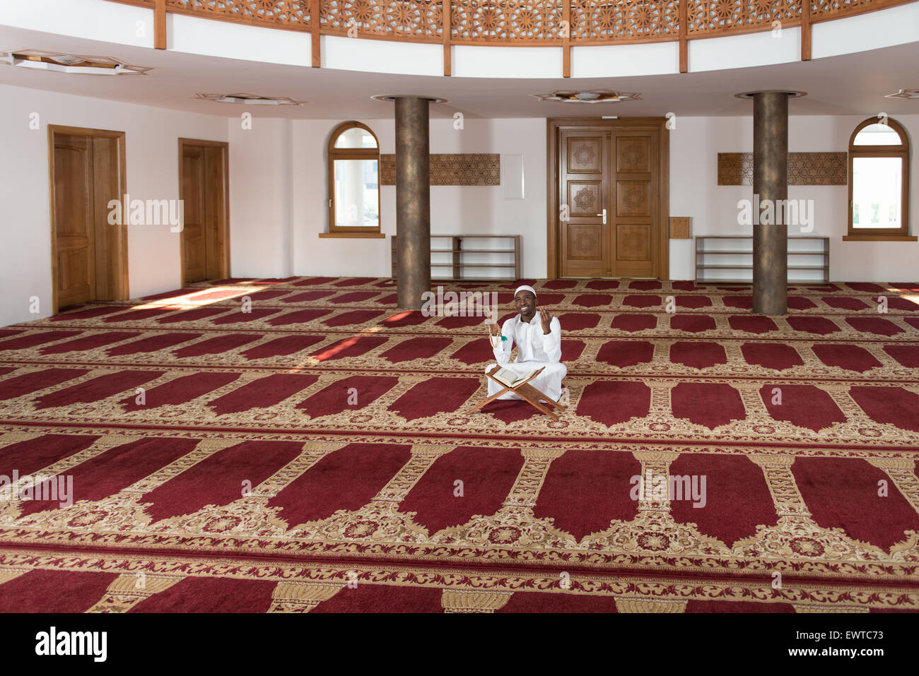 African Muslim Man Making Traditional Prayer To God While Wearing A ...
