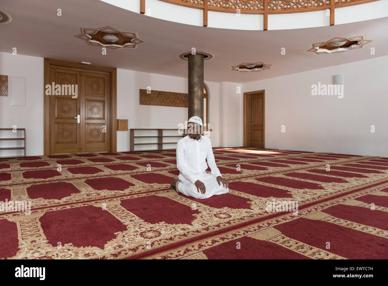 African Muslim Man Making Traditional Prayer To God While Wearing A ...