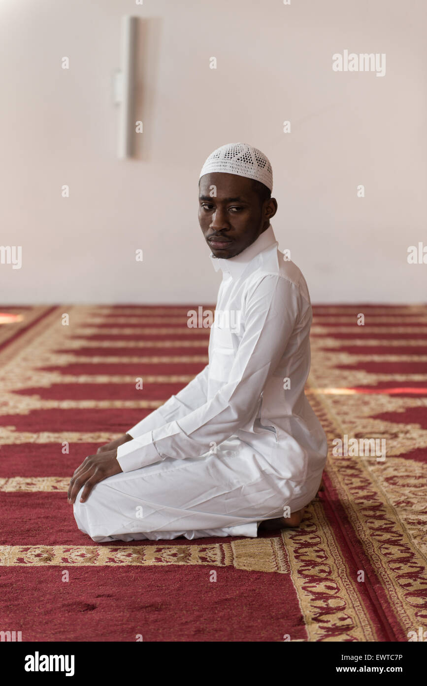 African Muslim Man Making Traditional Prayer To God While Wearing A ...