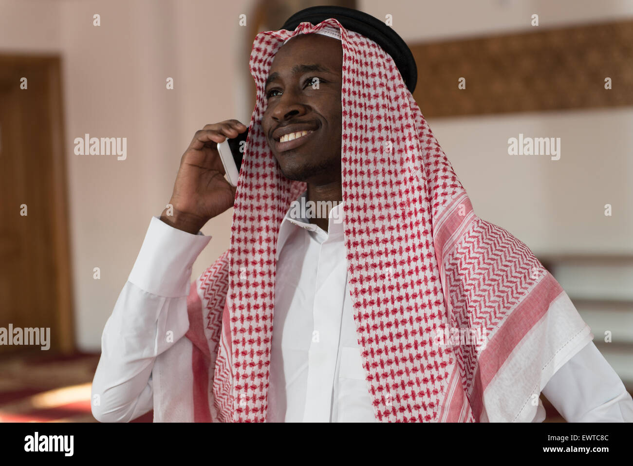 Handsome Middle Eastern Man Talking On Mobile Phone Stock Photo - Alamy