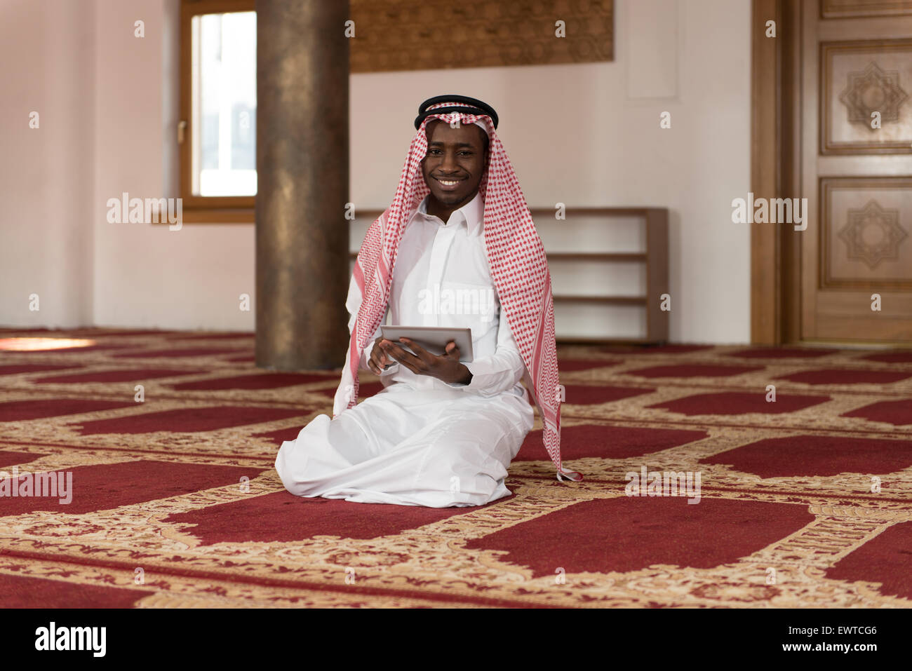 Arab Saudi Emirates Man Using A Smart Touchpad Stock Photo - Alamy