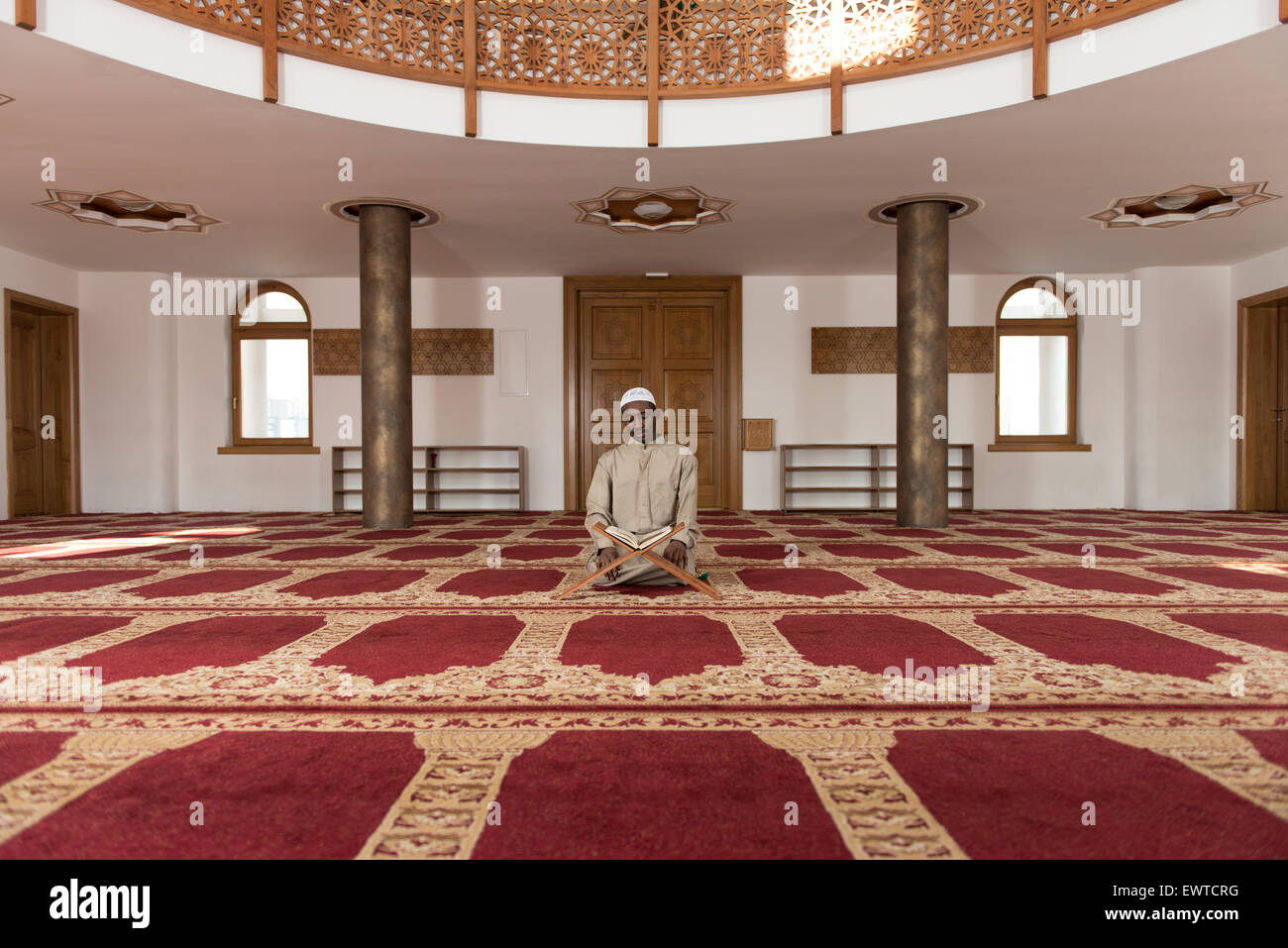 Black African Muslim Man Reading Holy Islamic Book Koran Stock Photo ...