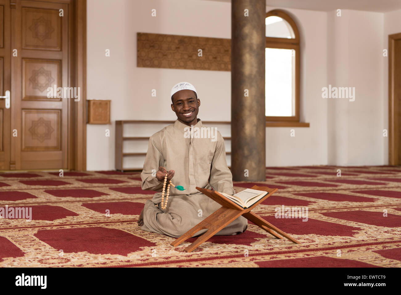 Black African Muslim Man Reading Holy Islamic Book Koran Stock Photo ...