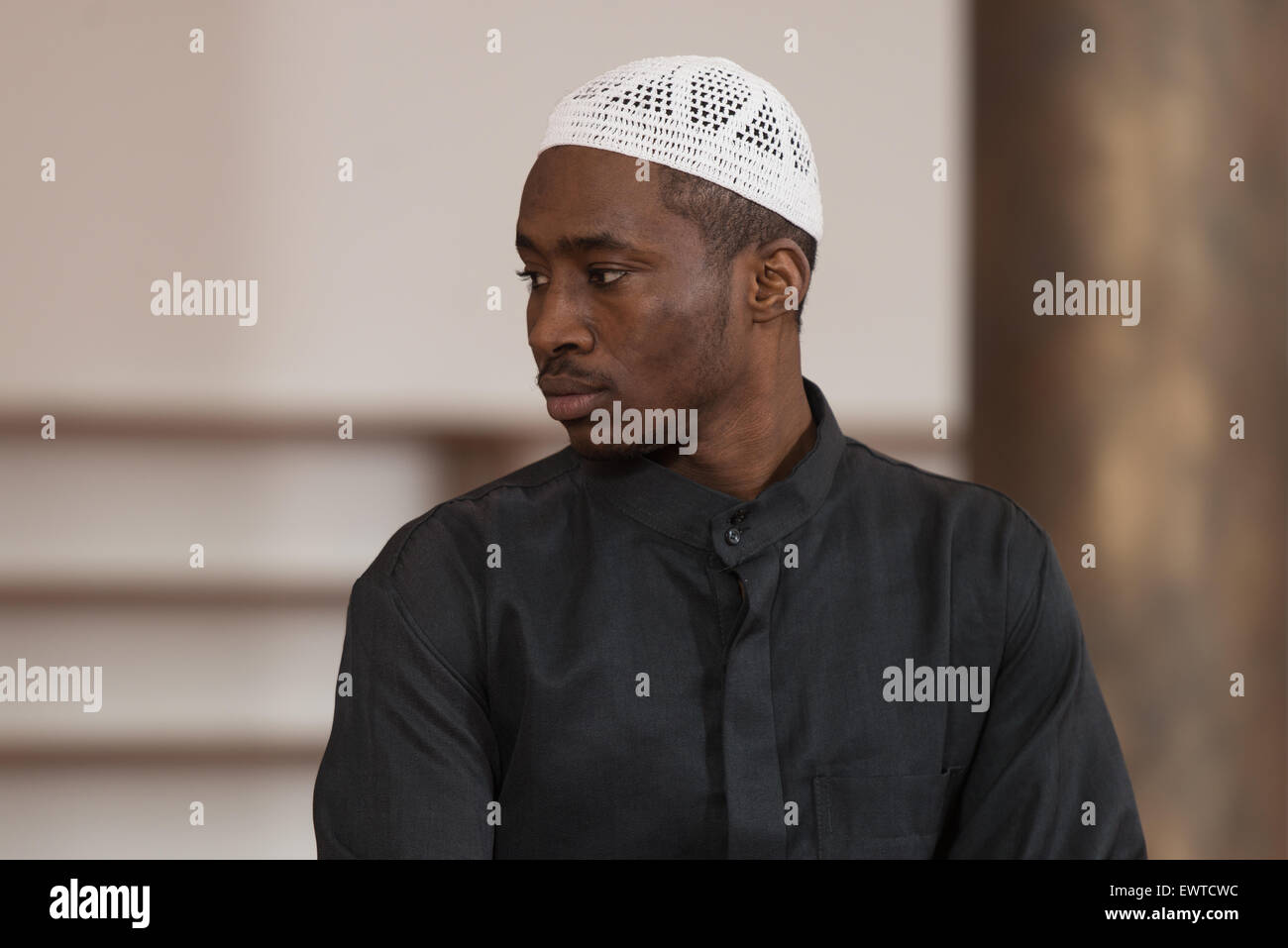 African Muslim Man Making Traditional Prayer To God While Wearing A ...