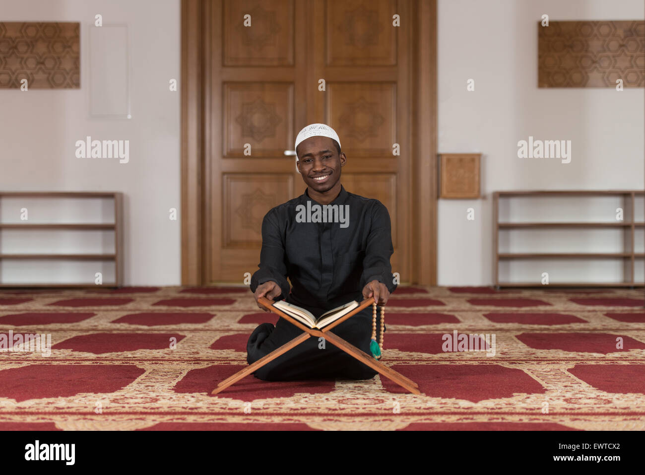 Black African Muslim Man Reading Holy Islamic Book Koran Stock Photo ...