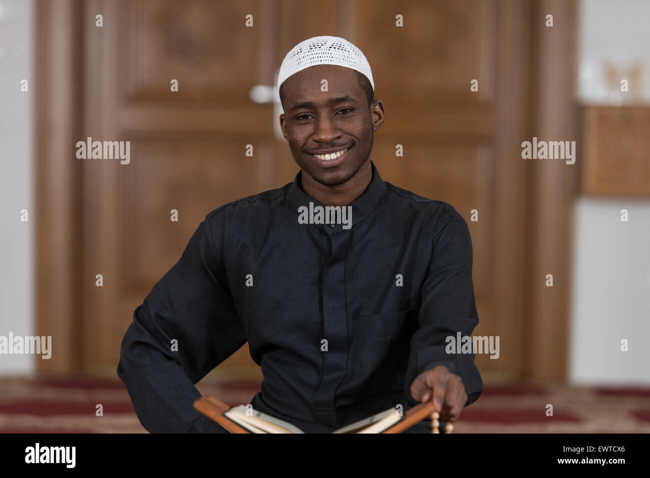 Black African Muslim Man Reading Holy Islamic Book Koran Stock Photo ...