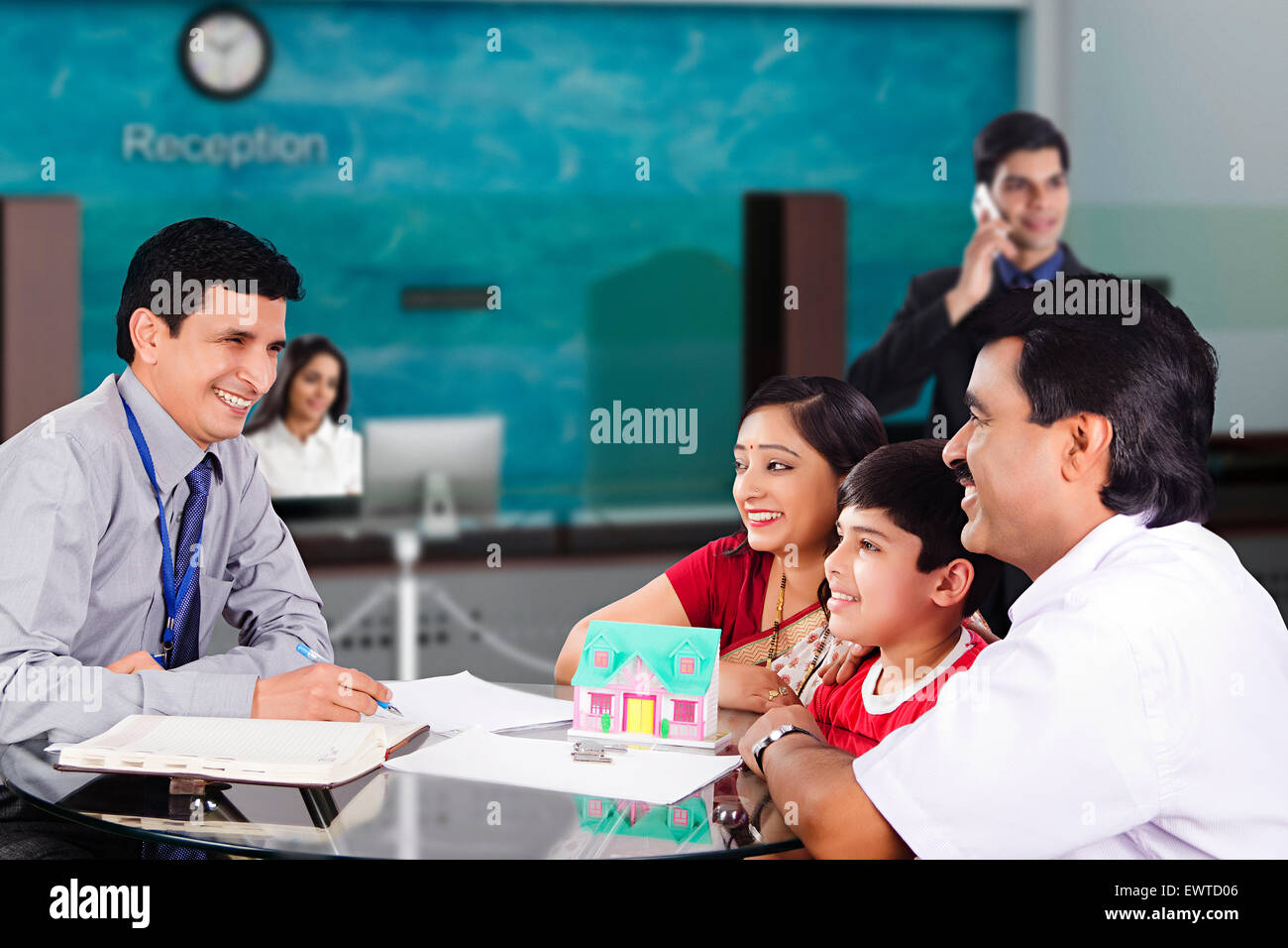 indian Parents and Salesperson House Dealing Stock Photo - Alamy