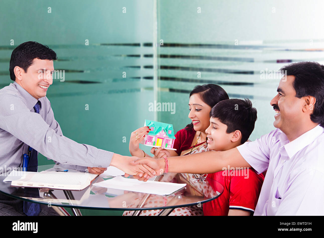 indian Parents and Salesperson House Dealing Stock Photo - Alamy