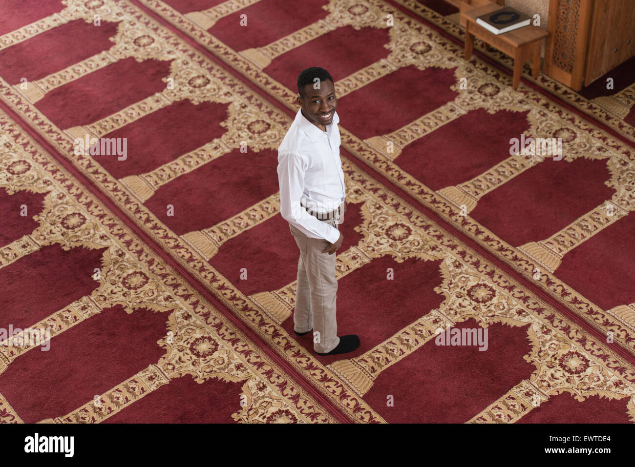 Handsome Black Man Smiling Is Praying In The Mosque Stock Photo - Alamy